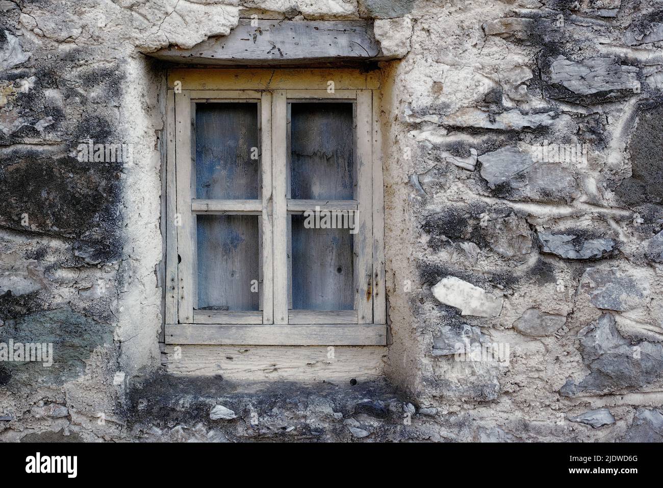 Closeup of a wooden frame window on ancient house in a village ...