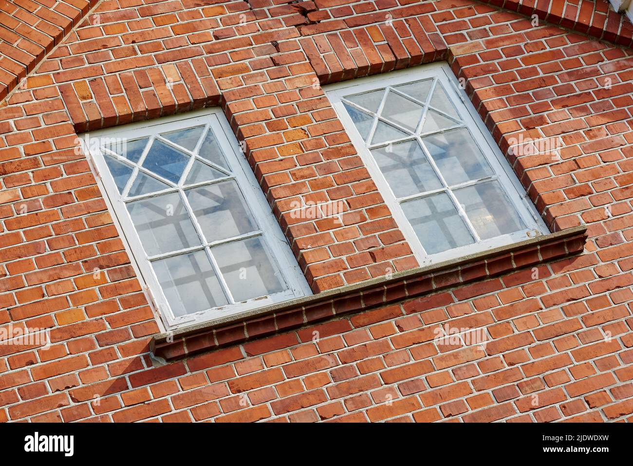 Old stone wall with two rectangular windows. Close up of rectangular ...