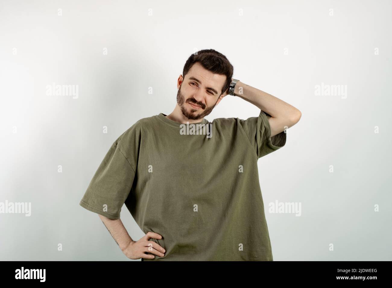 Caucasian young man wearing t-shirt posing isolated over white ...