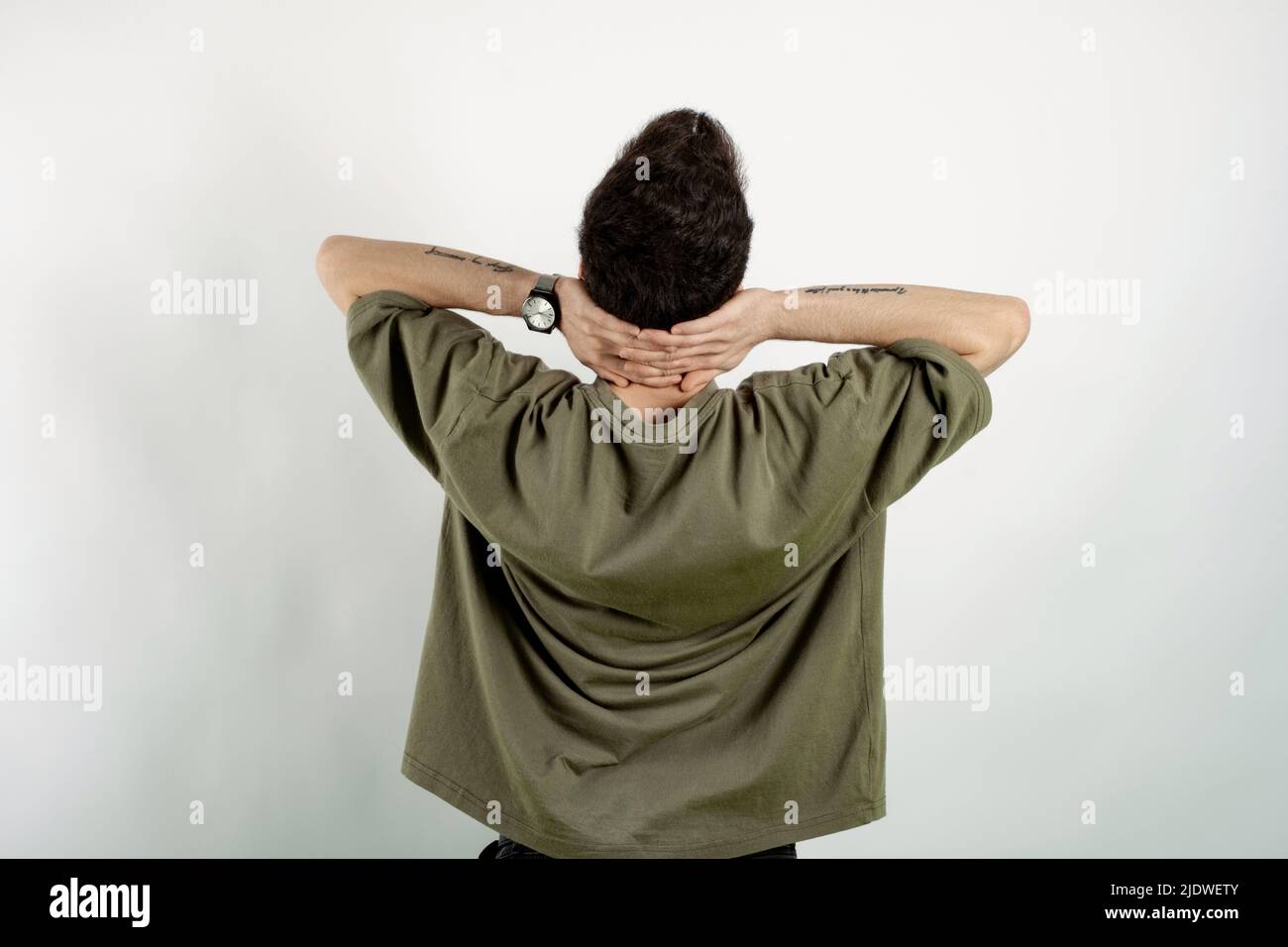 Man stretching arms behind back High Resolution Stock Photography and ...