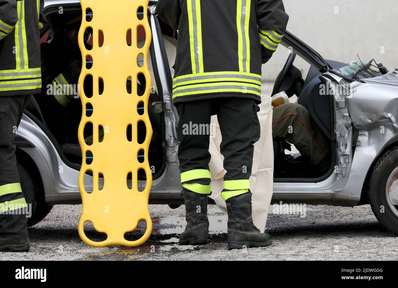 firefighters in action during the rescue of the injured after the car ...