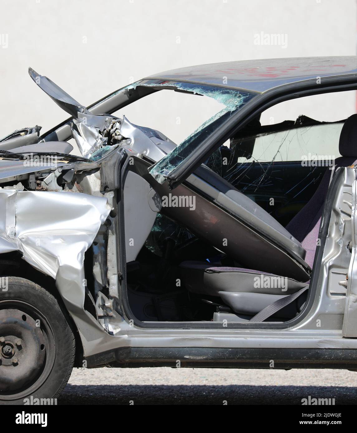 completely destroyed car with shattered glass after the incredible ...
