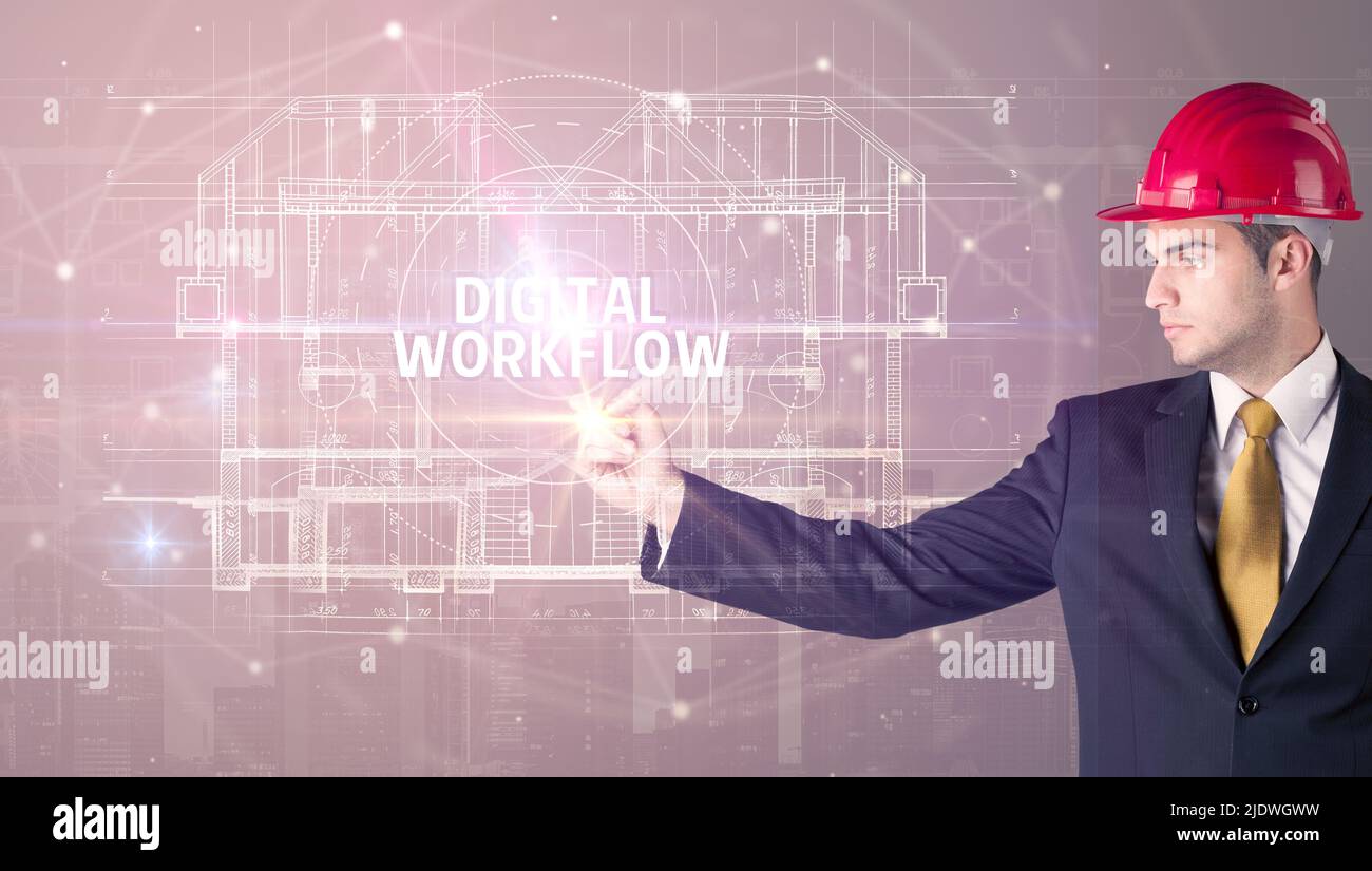 Handsome architect drawing with helmet Stock Photo - Alamy