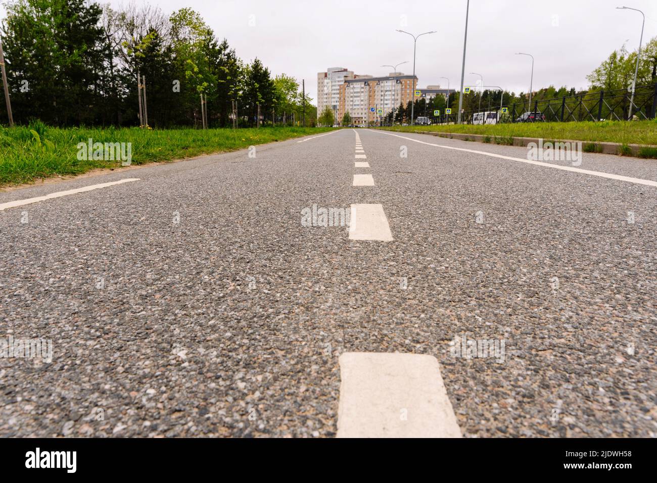 an empty city bike path along a city street in summer Stock Photo - Alamy
