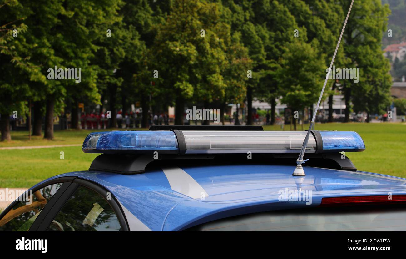Blue police car sirens as they patrol the public park looking for ...