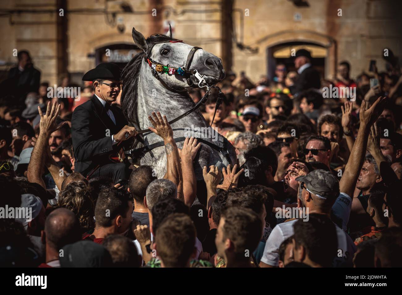 Ciutadella, Spain. 23rd June, 2022. A 'caixer' (horse rider) rears up ...