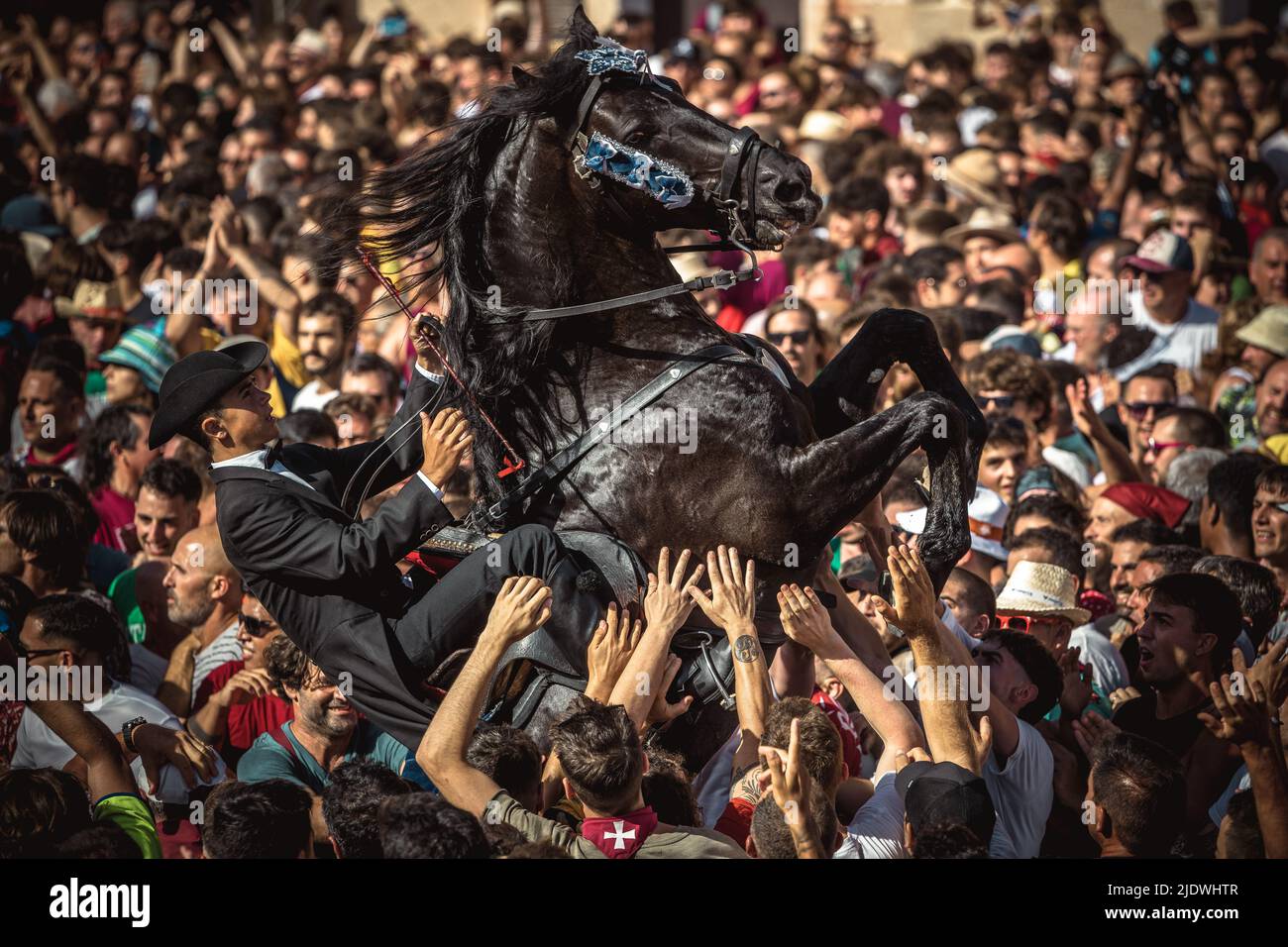 Ciutadella, Spain. 23rd June, 2022. A 'caixer' (horse rider) rears up ...