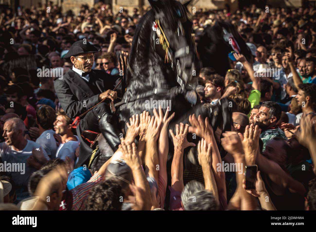 Ciutadella, Spain. 23rd June, 2022. A 'caixer' (horse rider) rears up ...