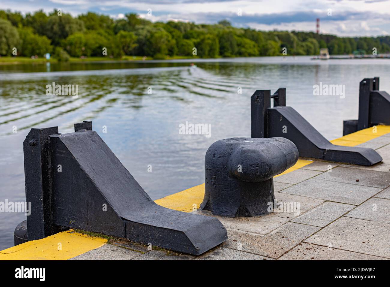 black metal bollard on an empty pier on the river. High quality photo Stock Photo - Alamy