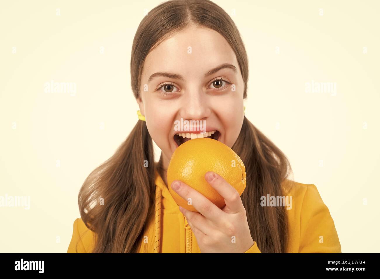 healthy life. diet and kid skin beauty. happy teen girl with orange ...