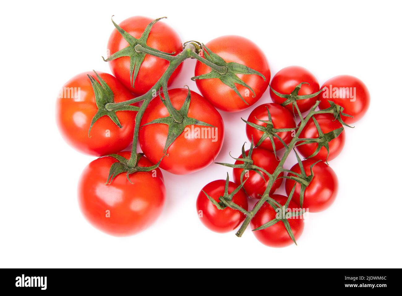 Organic red cherry tomato clusters of different size isolated on white ...