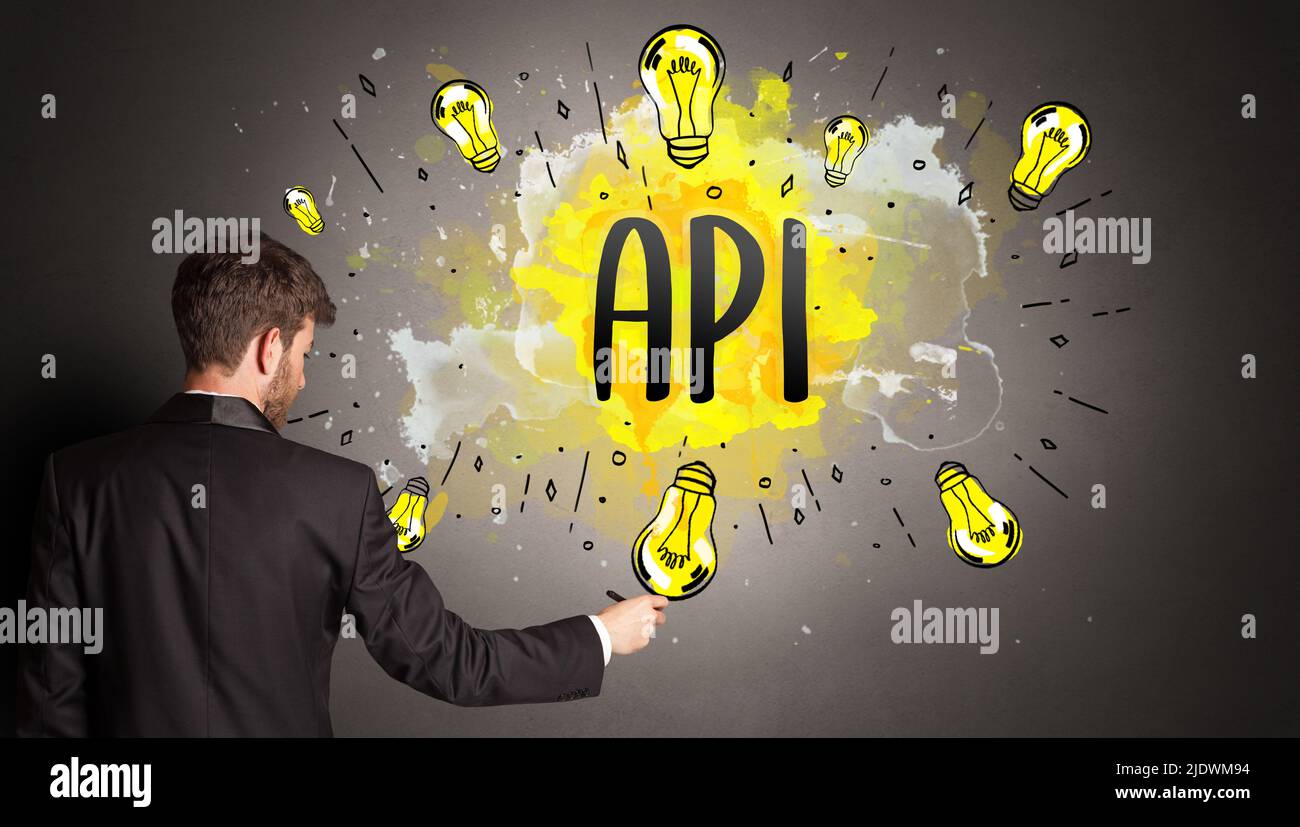 man drawing colorful light bulb Stock Photo - Alamy