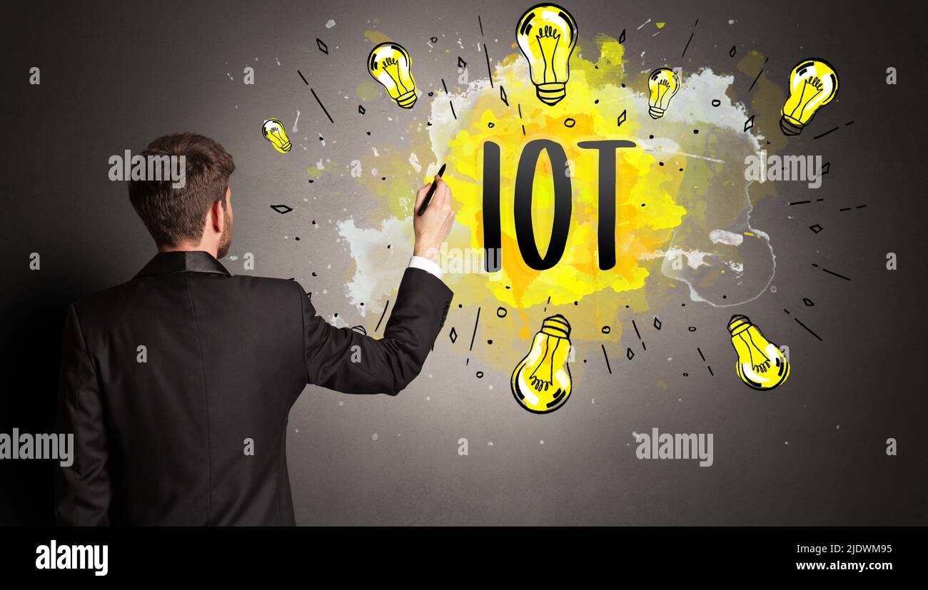 man drawing colorful light bulb Stock Photo - Alamy
