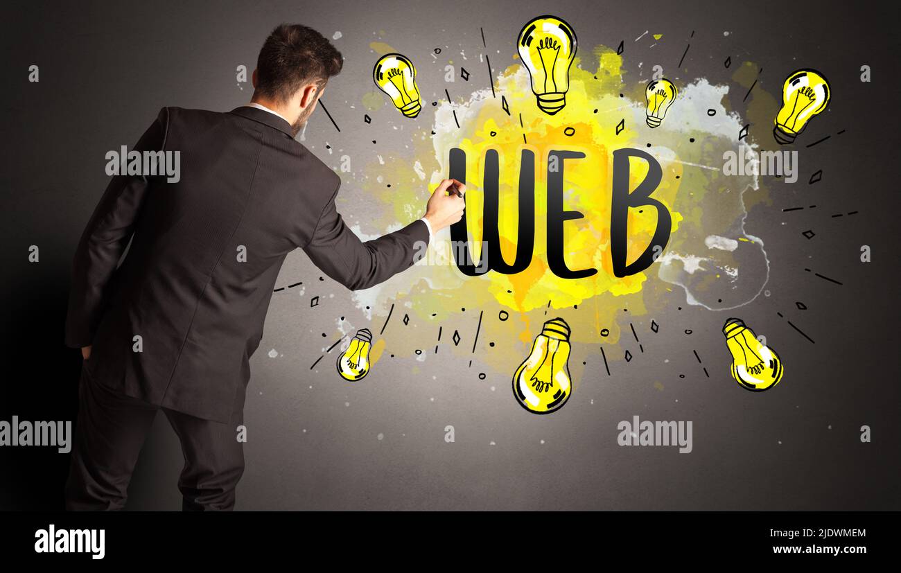 man drawing colorful light bulb Stock Photo - Alamy