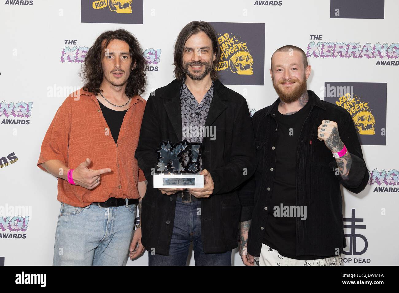 Brian Bell of Weezer (centre) and award presenters from Deaf Havana ...
