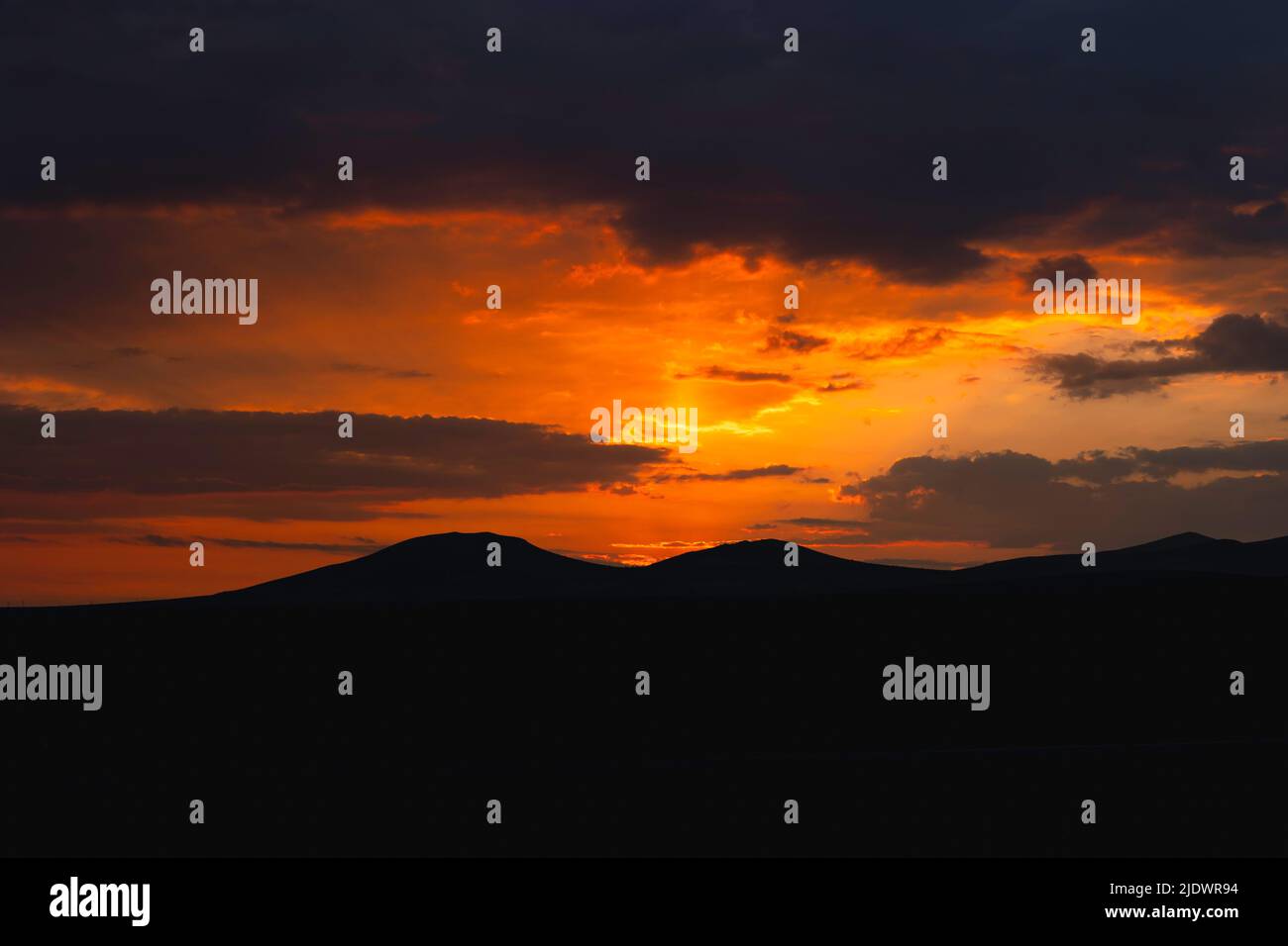 Sunrise or sunset over the hills or mountains. Morning or evening ...