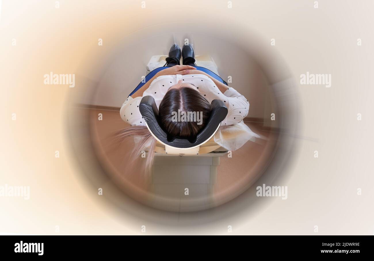 Female patient undergoing MRI - Magnetic resonance imaging in Hospital ...