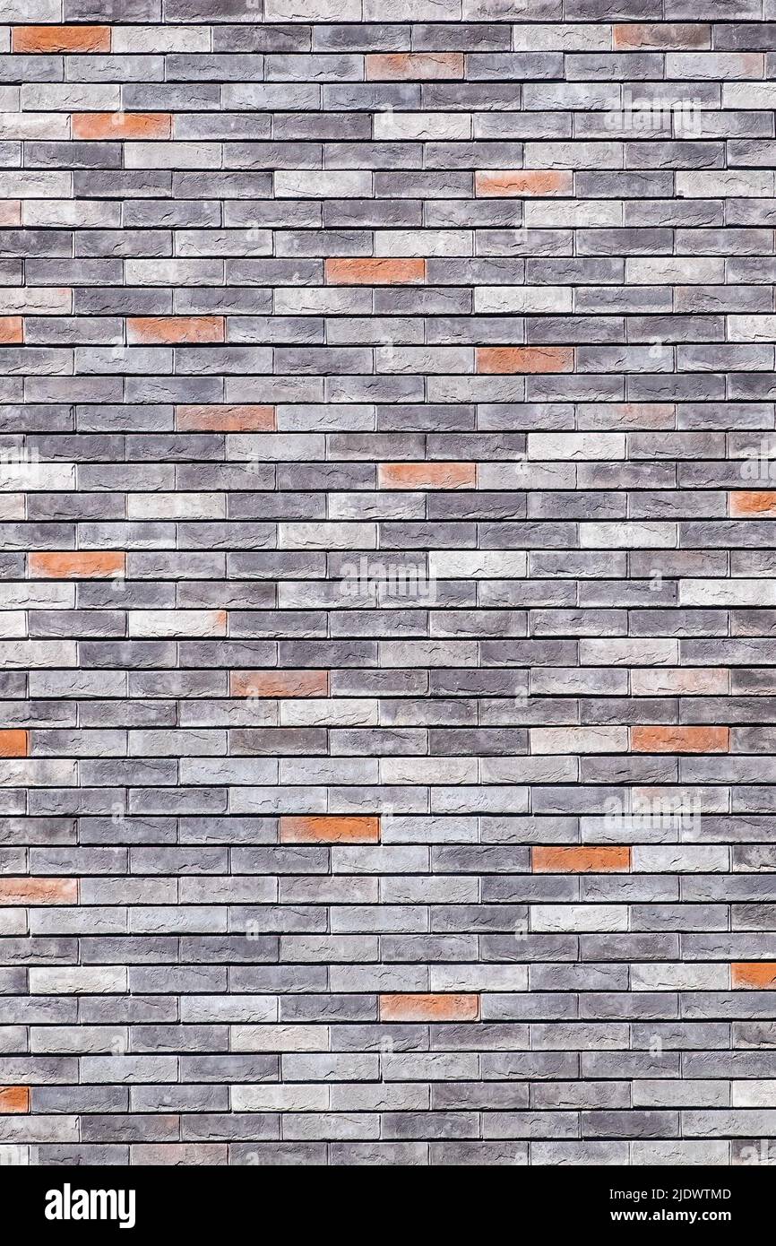 Decorative stone. Multicolored decorative stone wall pattern. Vertical ...