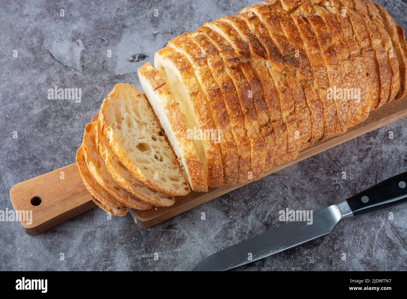 Fresh white loaf of bread on gray cement background. Top view Stock ...