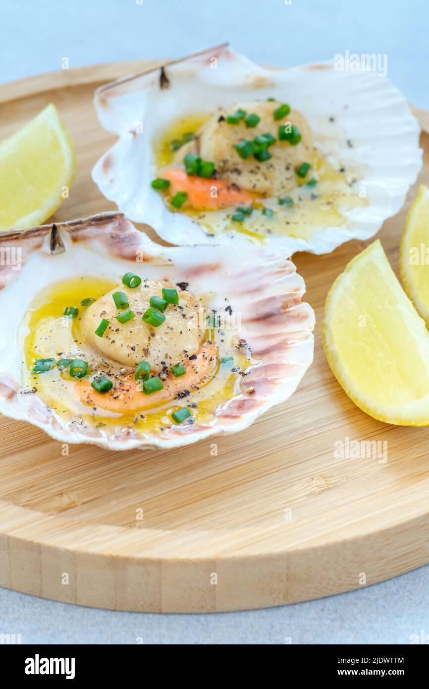King scallop with roe and butter sauce in shell Stock Photo - Alamy