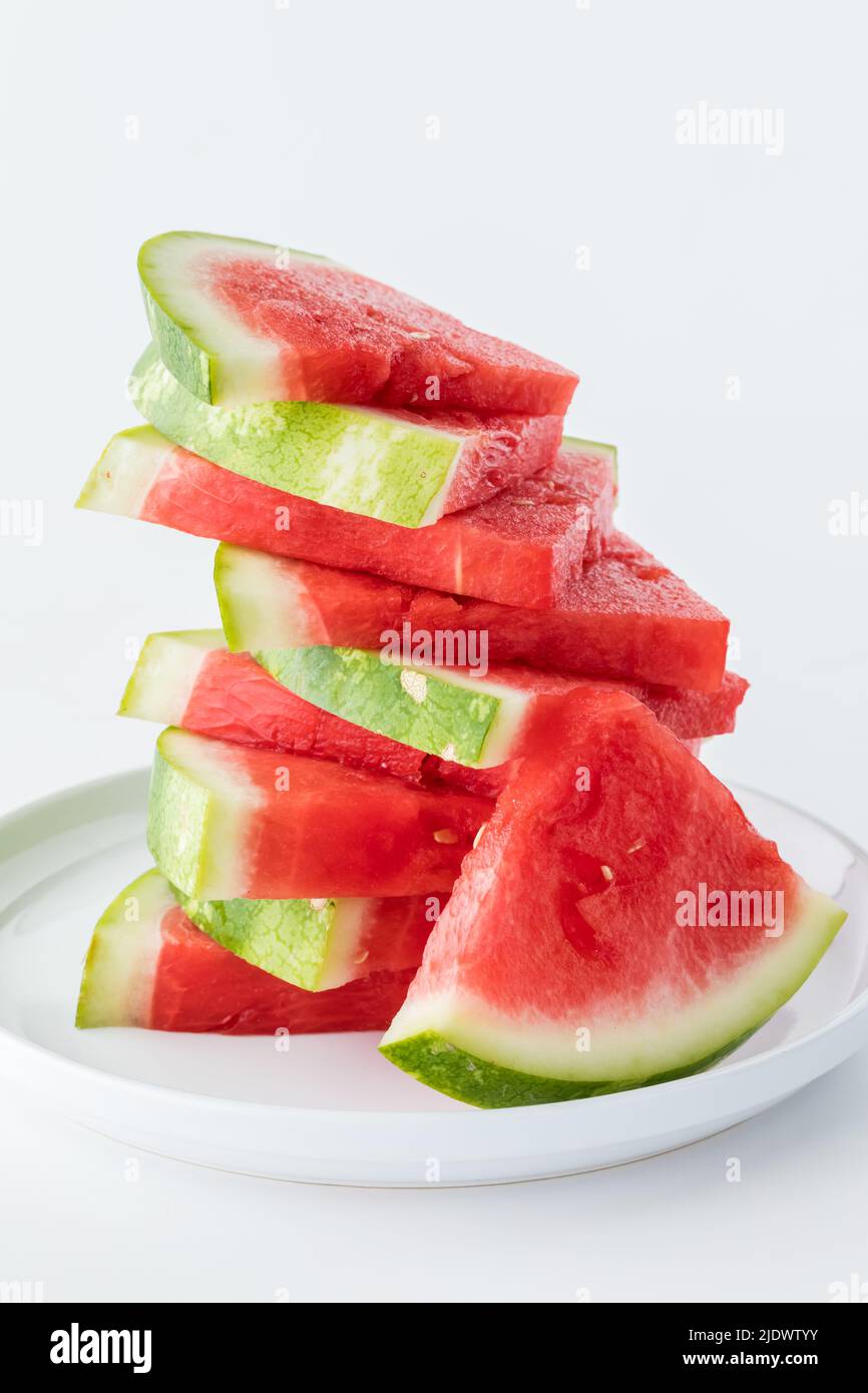 A stack of juicy watermelon slices against a white background Stock ...