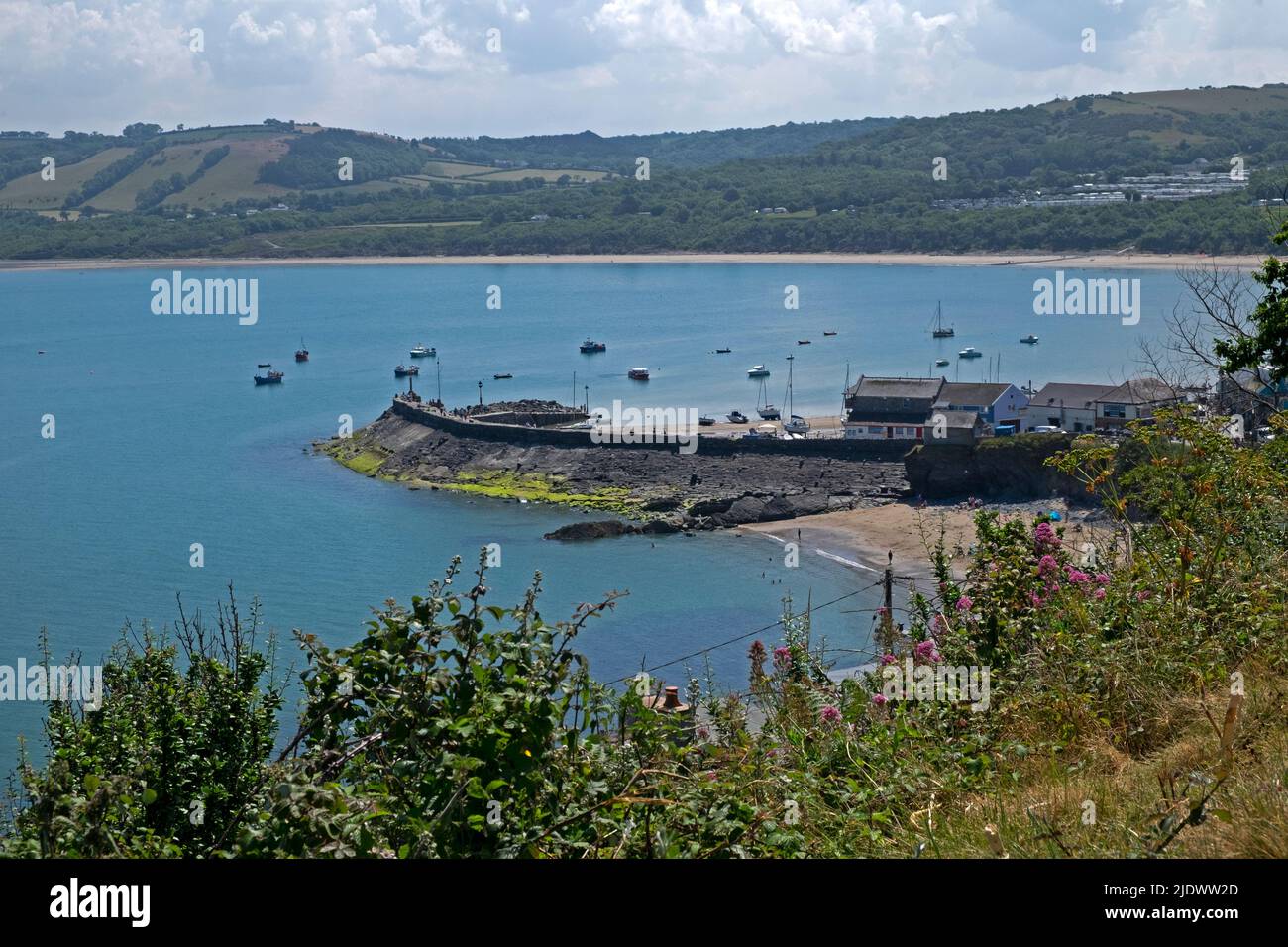 View of New Quay pier harbour boats beach on the Ceredigion coast in ...