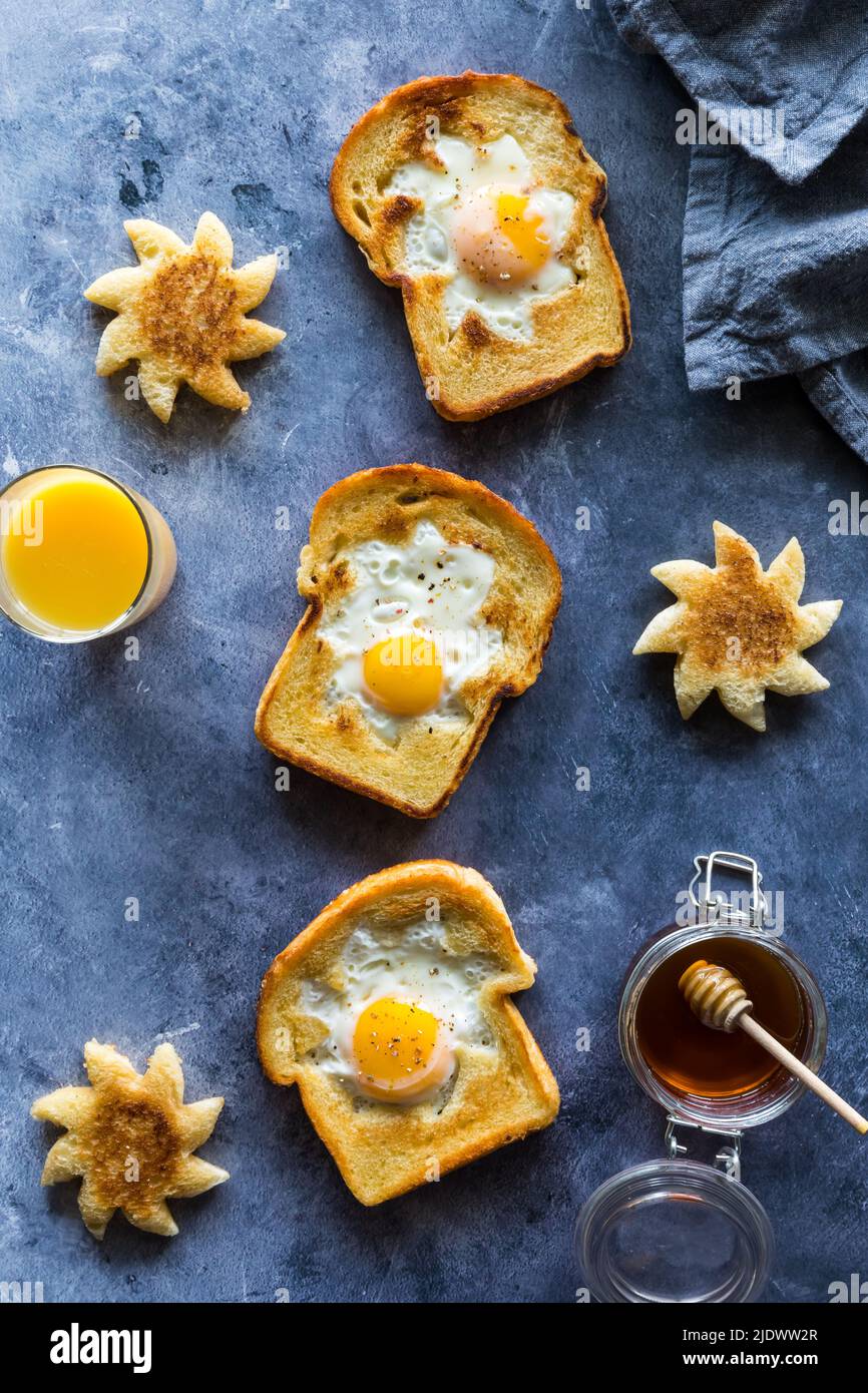 Top down view of sunshine toasts with fried eggs in the middle Stock ...
