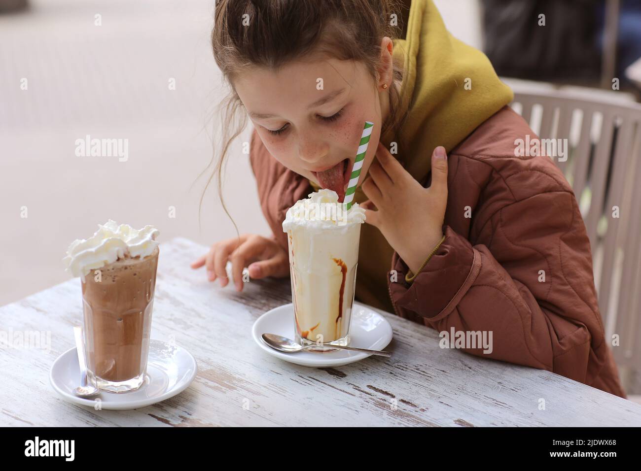 Adorable cute preschooler caucasian girl portrait drinking fresh tasty ...