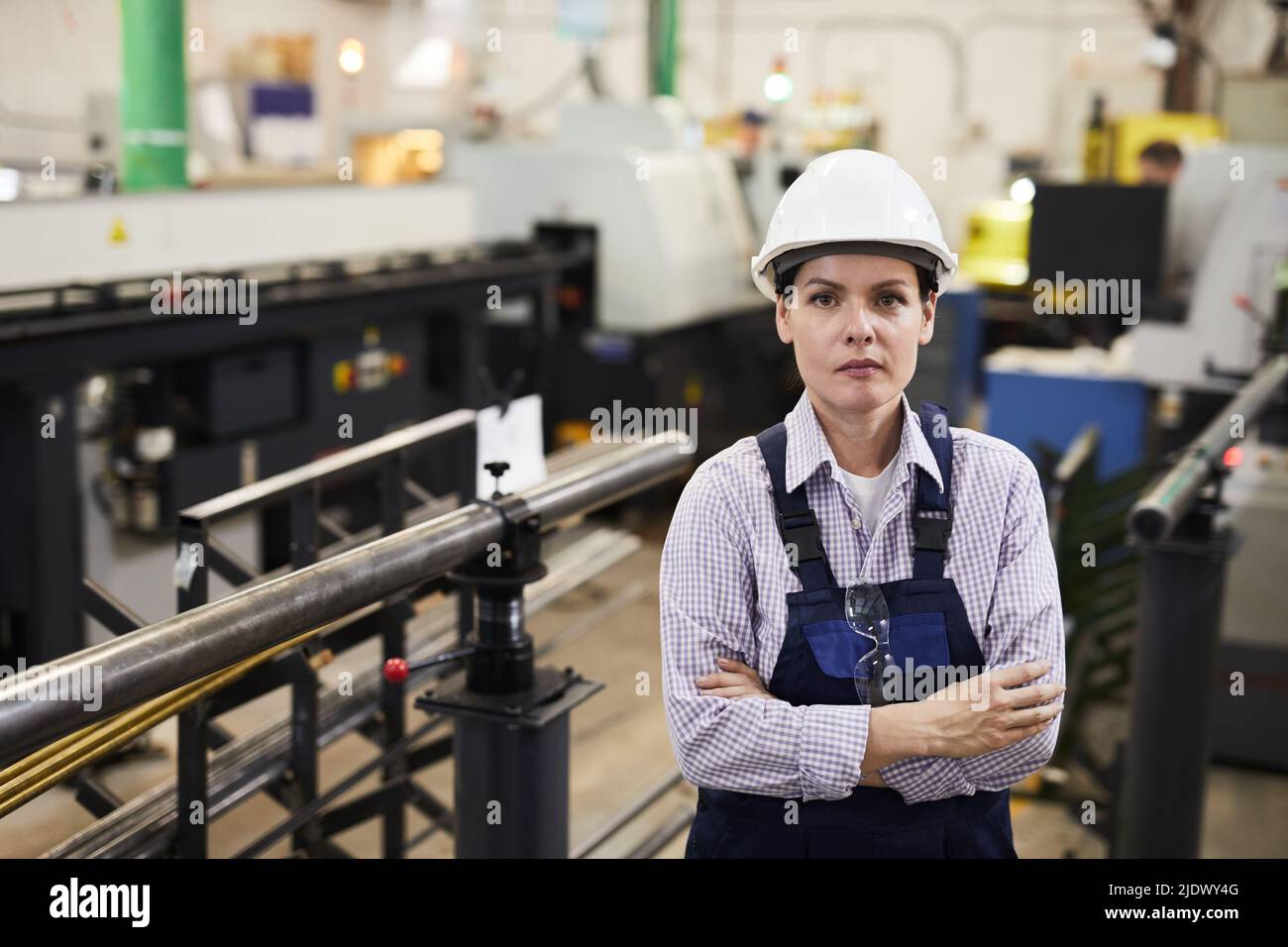 Portrait female warehouse standing arms hi-res stock photography and ...