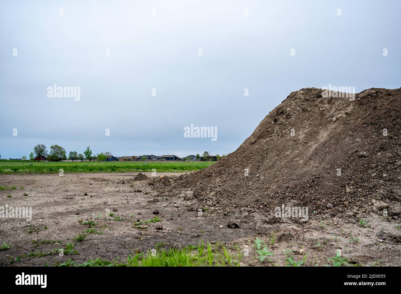 stockpiled topsoil at a residential development construction site Stock ...