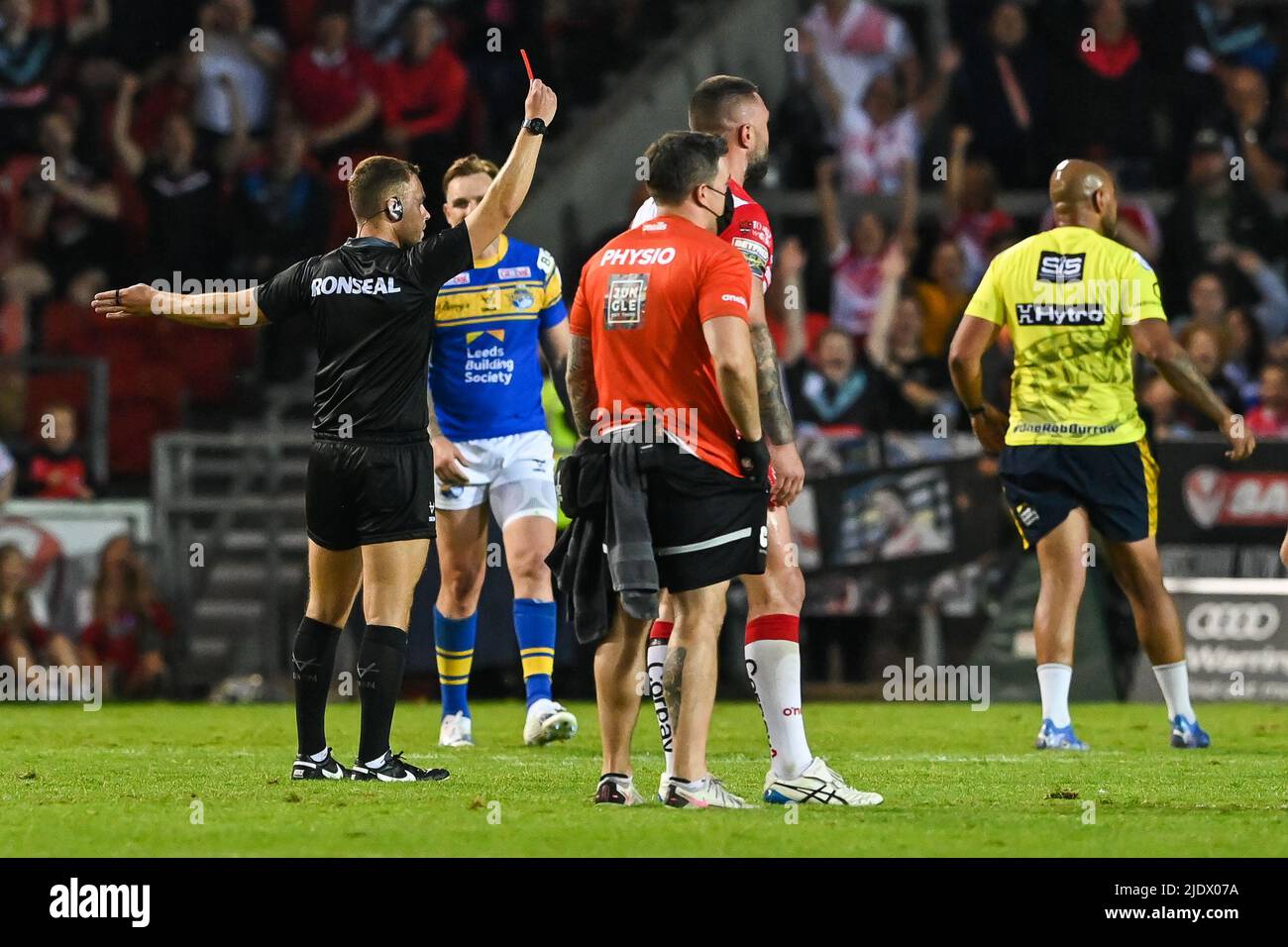 referee Tom Grant gives a red card to Zane Tetevano (13) of Leeds ...