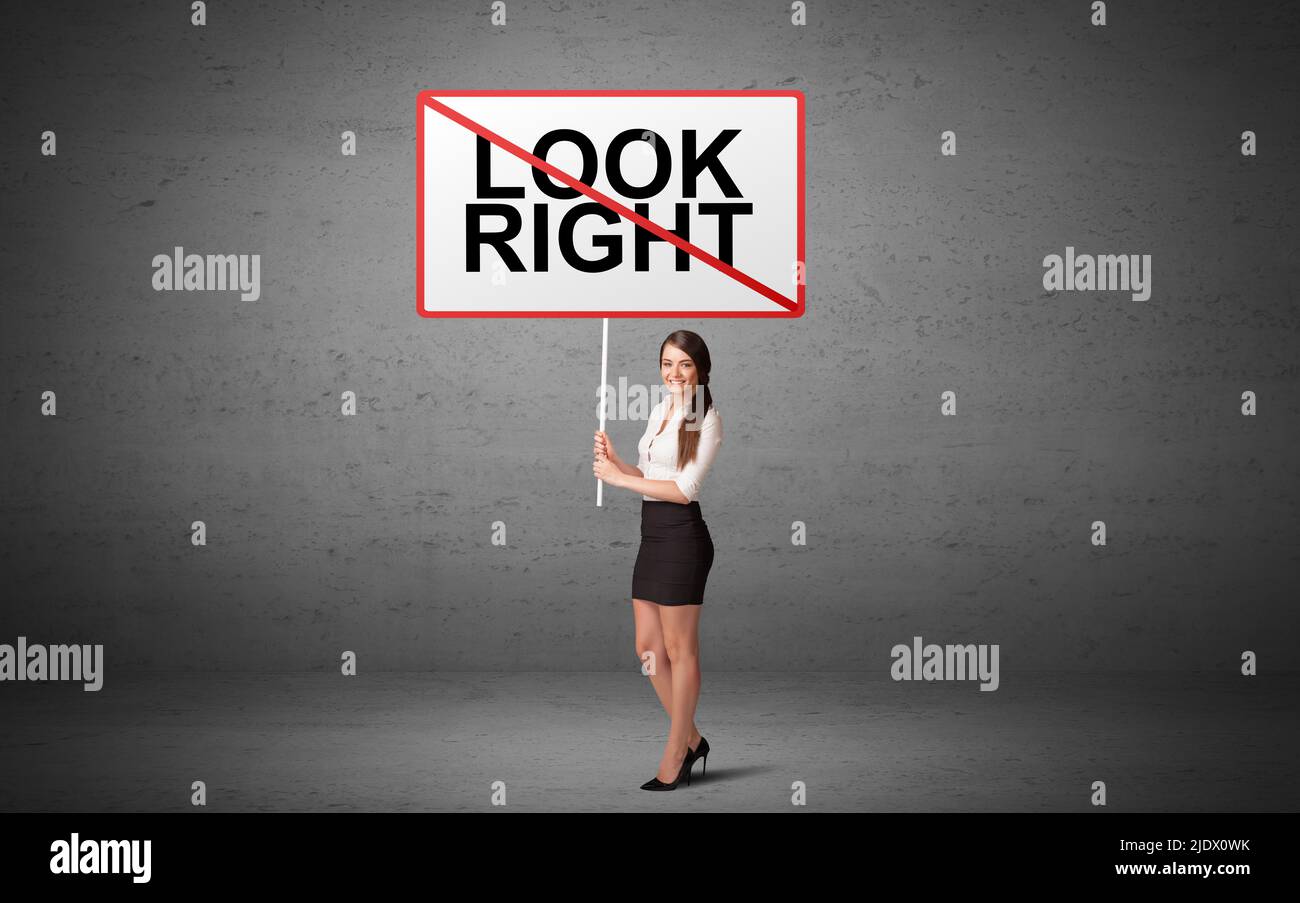business person holding a traffic sign Stock Photo - Alamy