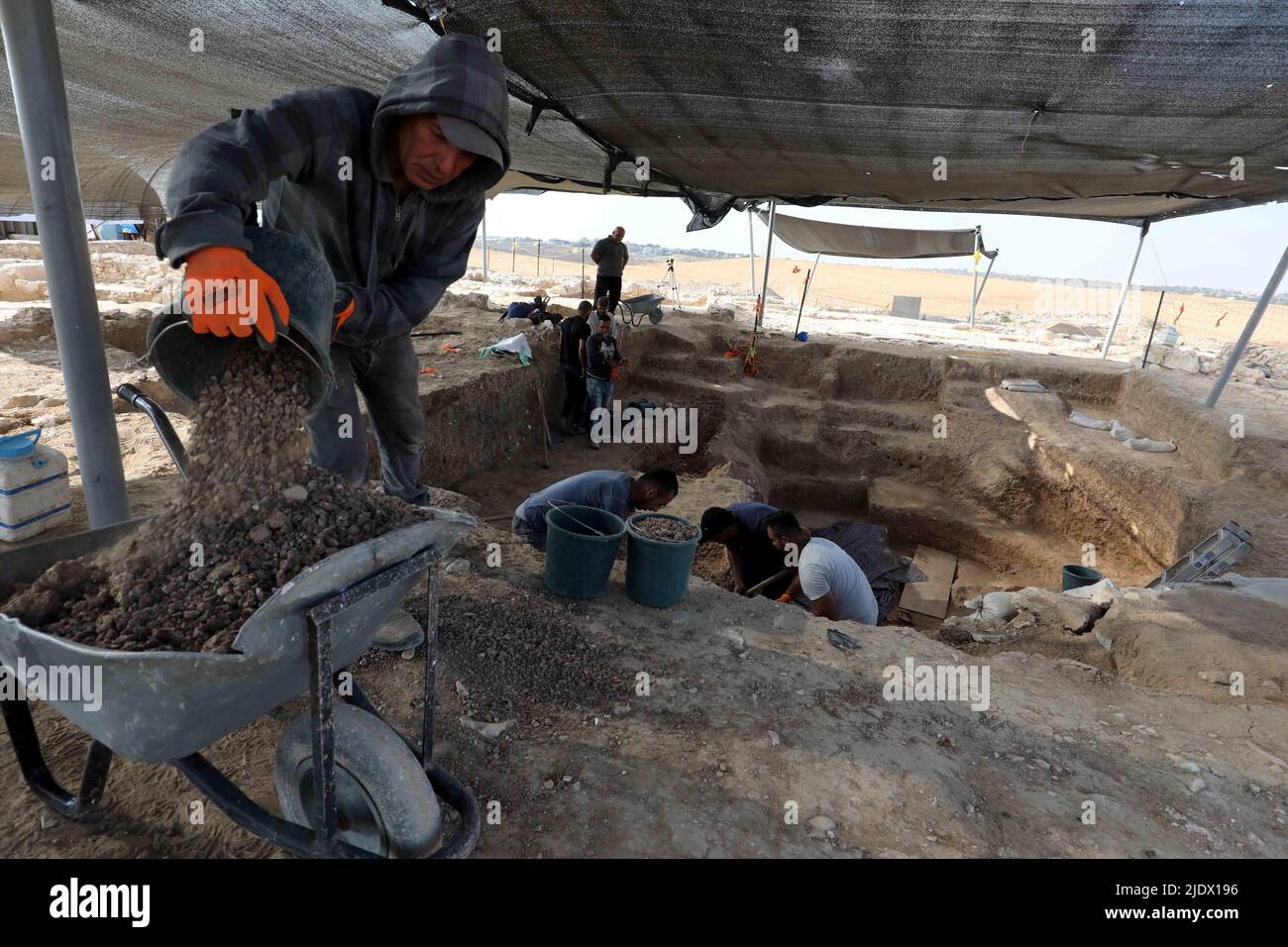 Rahat, Israel. 23rd June, 2022. People work around the relics of a ...