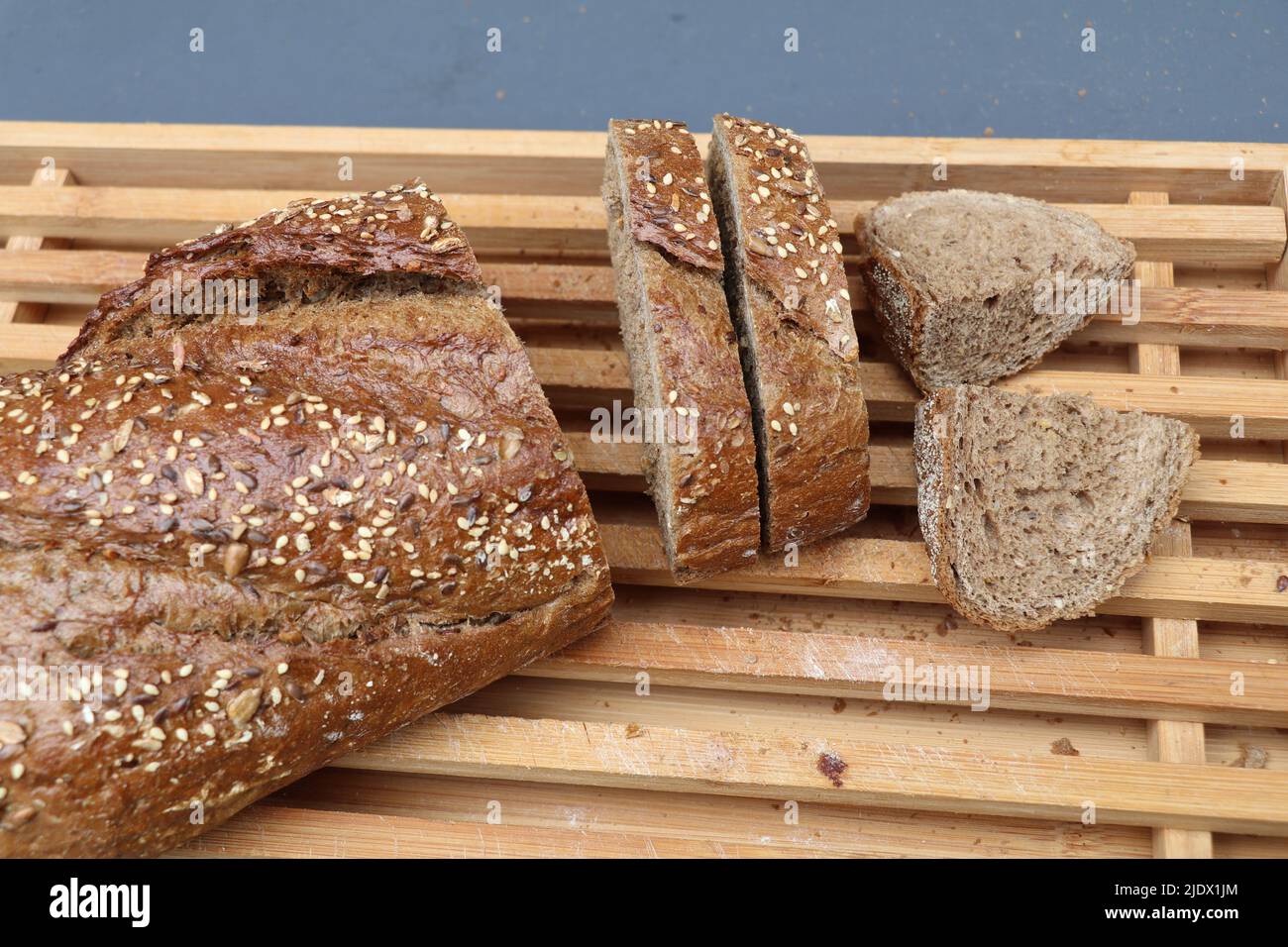 fresh loaf of bread cut into thick slices Stock Photo - Alamy