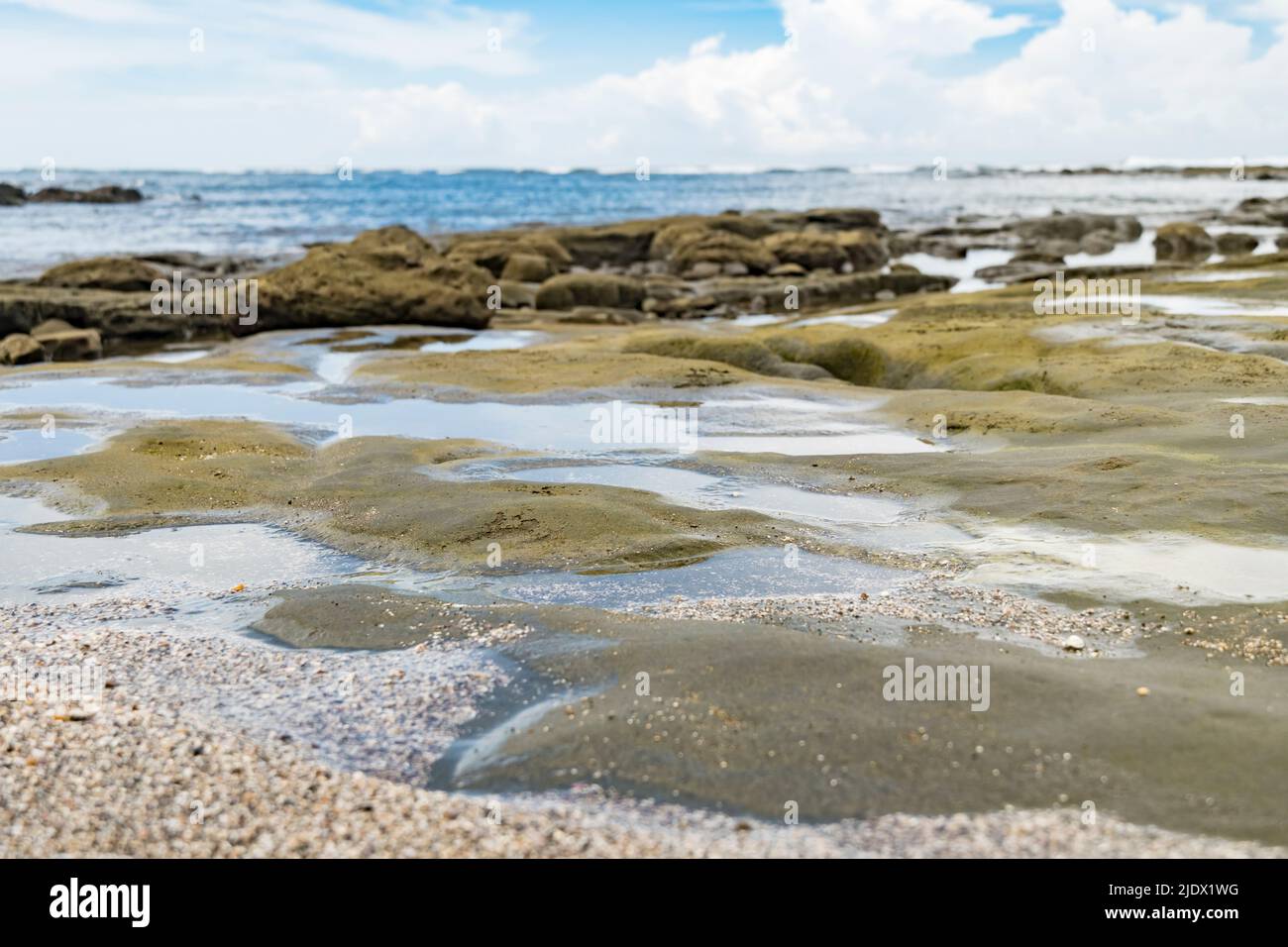 Abstract image, Selective focus plane of sand and rocks and the sea out ...