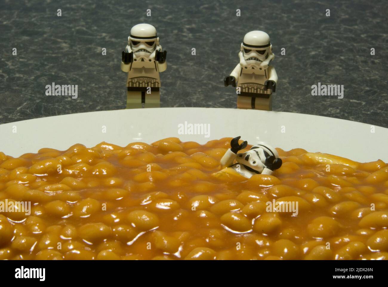 Lego stormtrooper trapped in beans on toast Stock Photo - Alamy