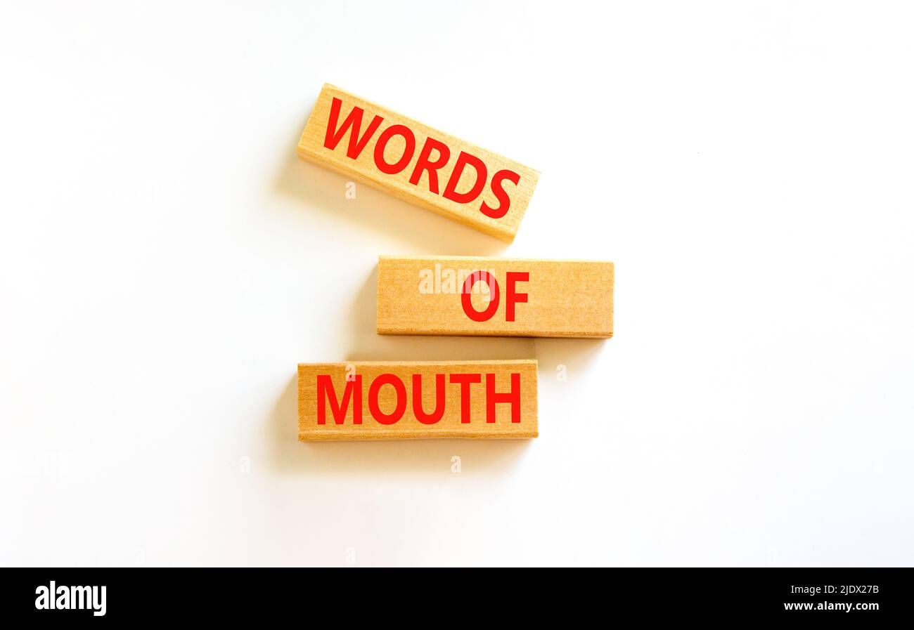 Words of mouth symbol. Concept words Words of mouth on wooden blocks on ...