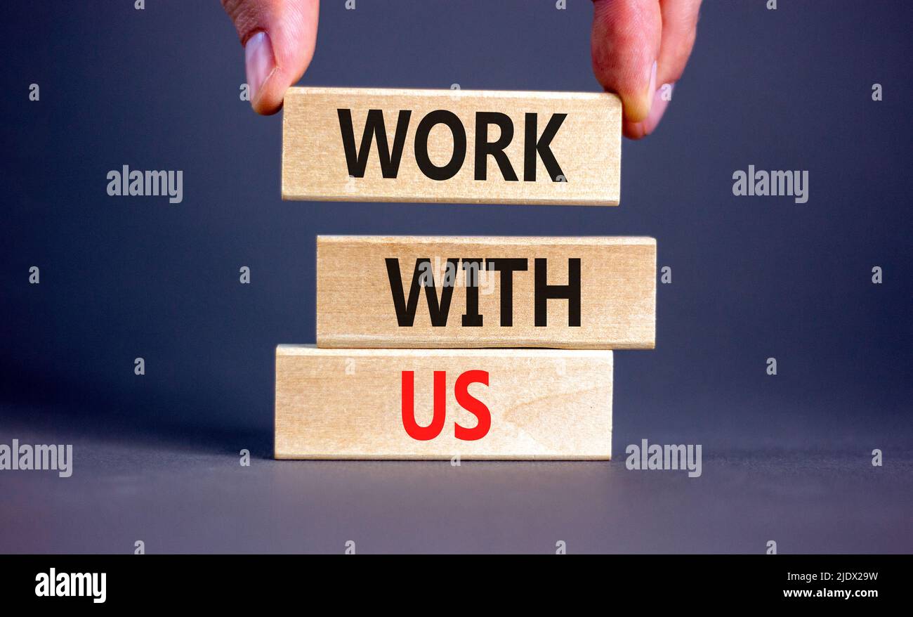Work with us symbol. Concept words Work with us on wooden blocks on a ...