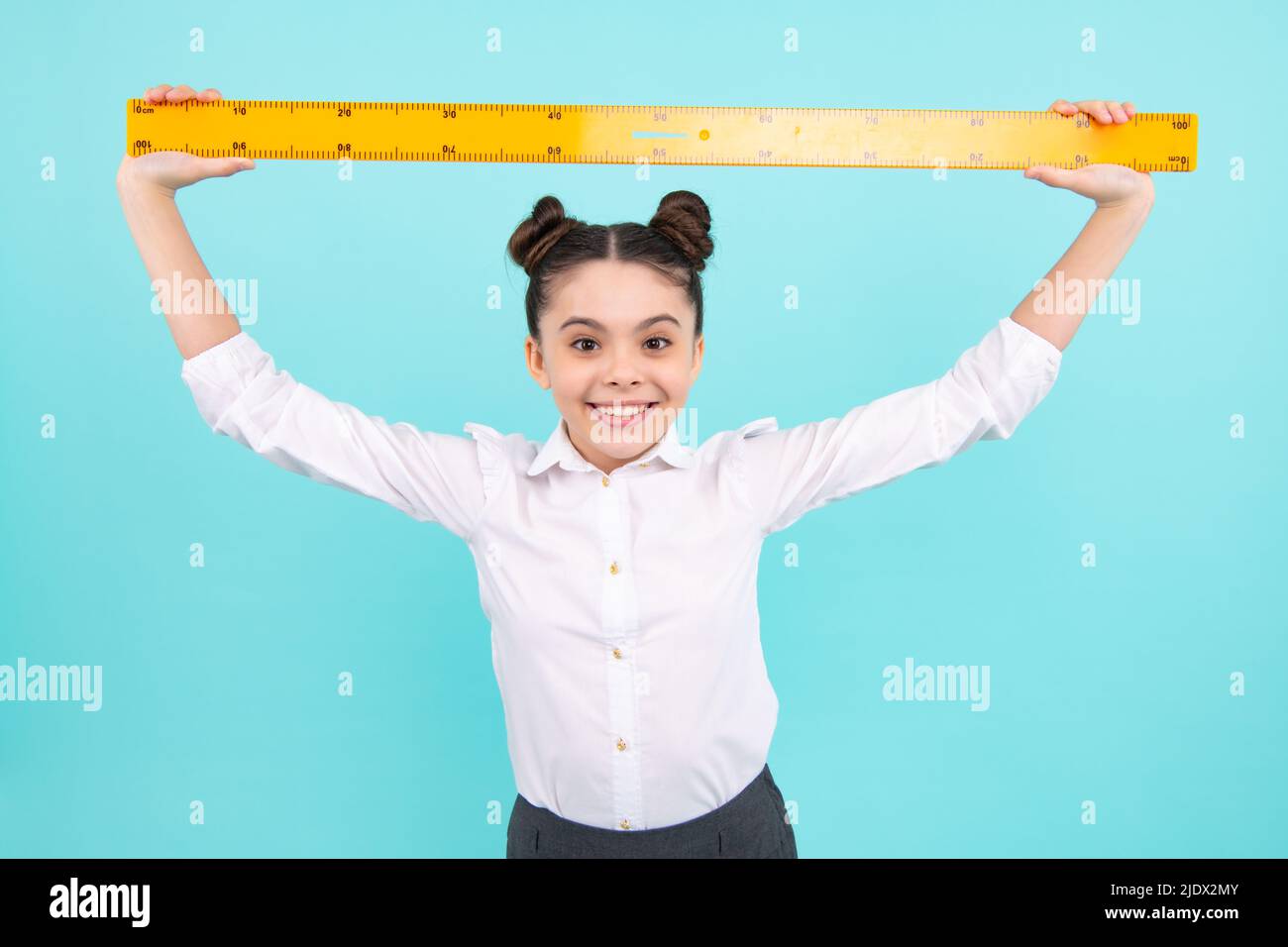 Teenager school girl study math or geometry lesson, measure the size ...