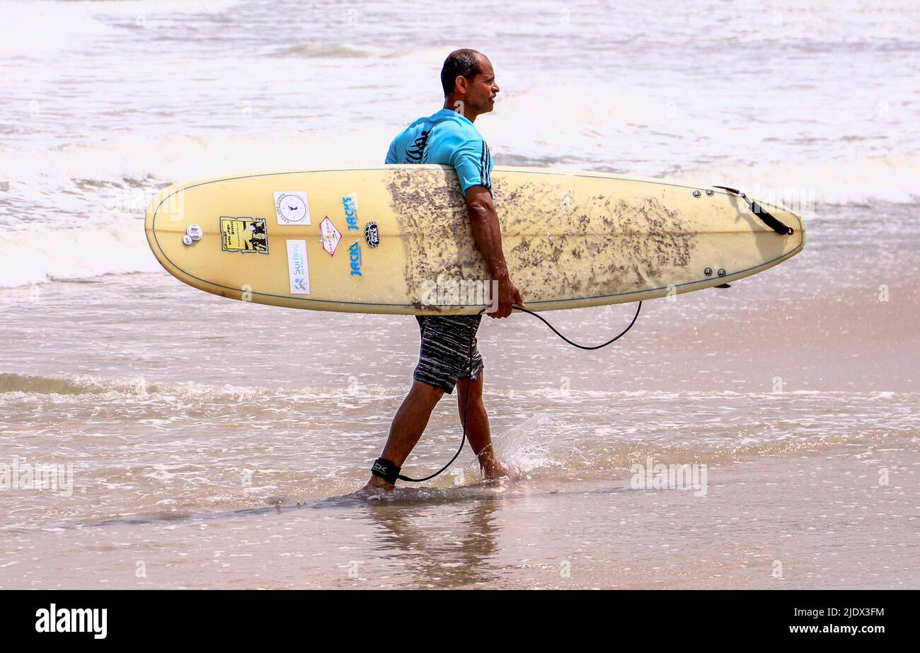 Palestinian athlete walks along the Mediterranean beach during the ...