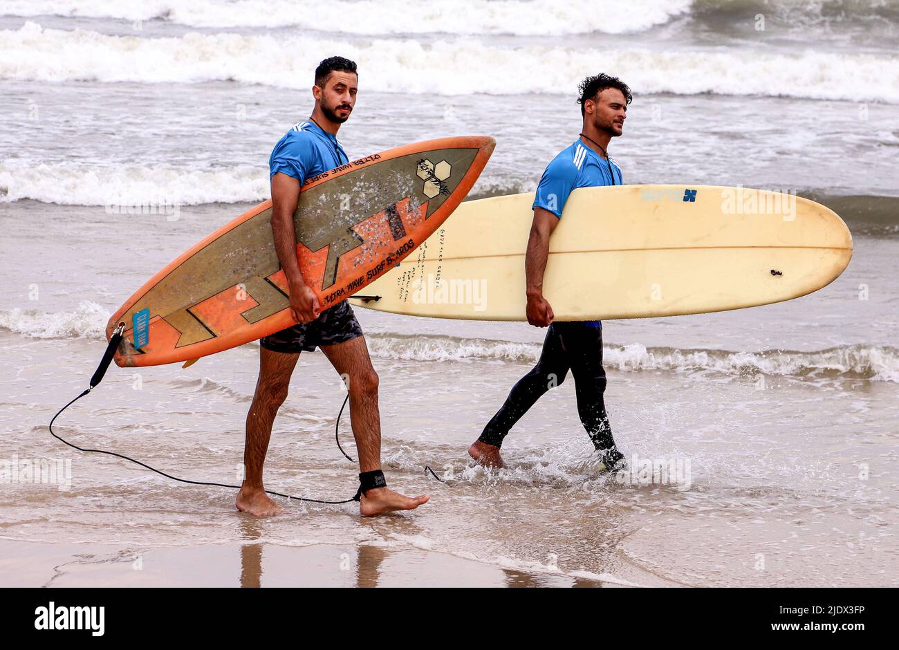 Palestinian athletes walk along the Mediterranean beach during the ...