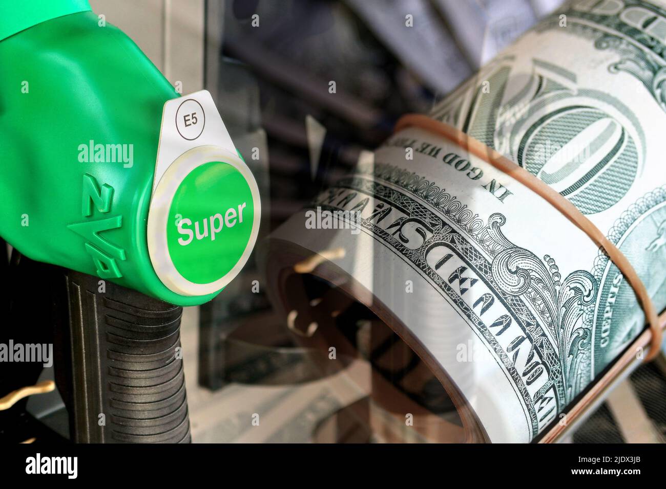 Fuel dispenser and cash dollars Stock Photo - Alamy