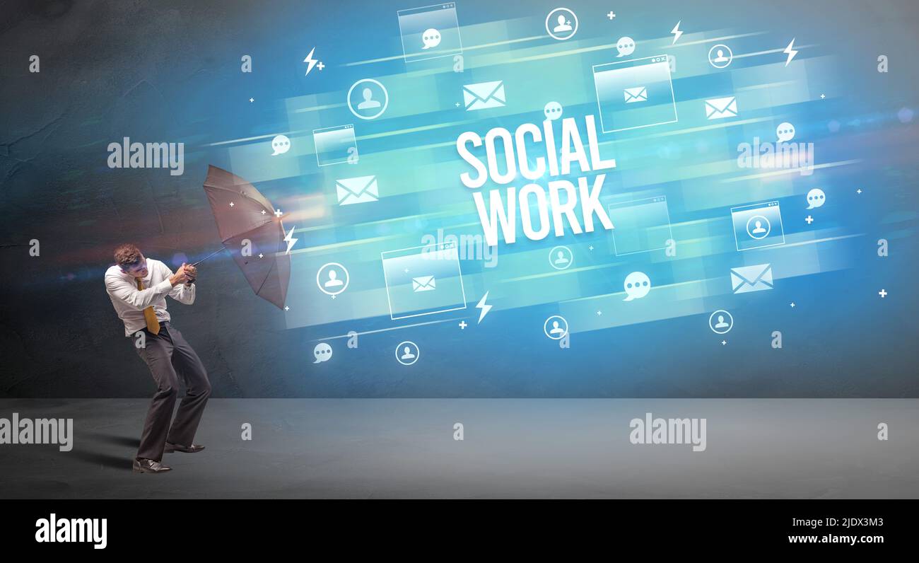businessman defending with umbrella concept Stock Photo - Alamy