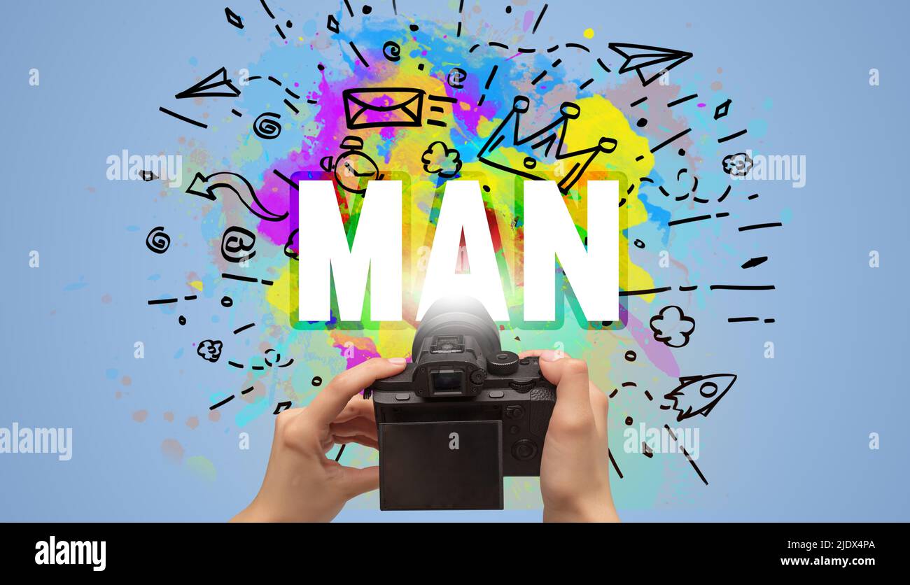 Close-up of a hand holding digital camera with abstract drawing Stock ...