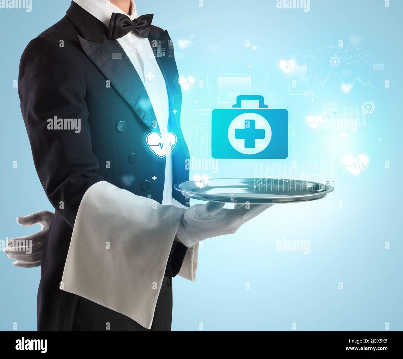 Handsome young waiter in tuxedo holding healthcare icons on tray Stock ...