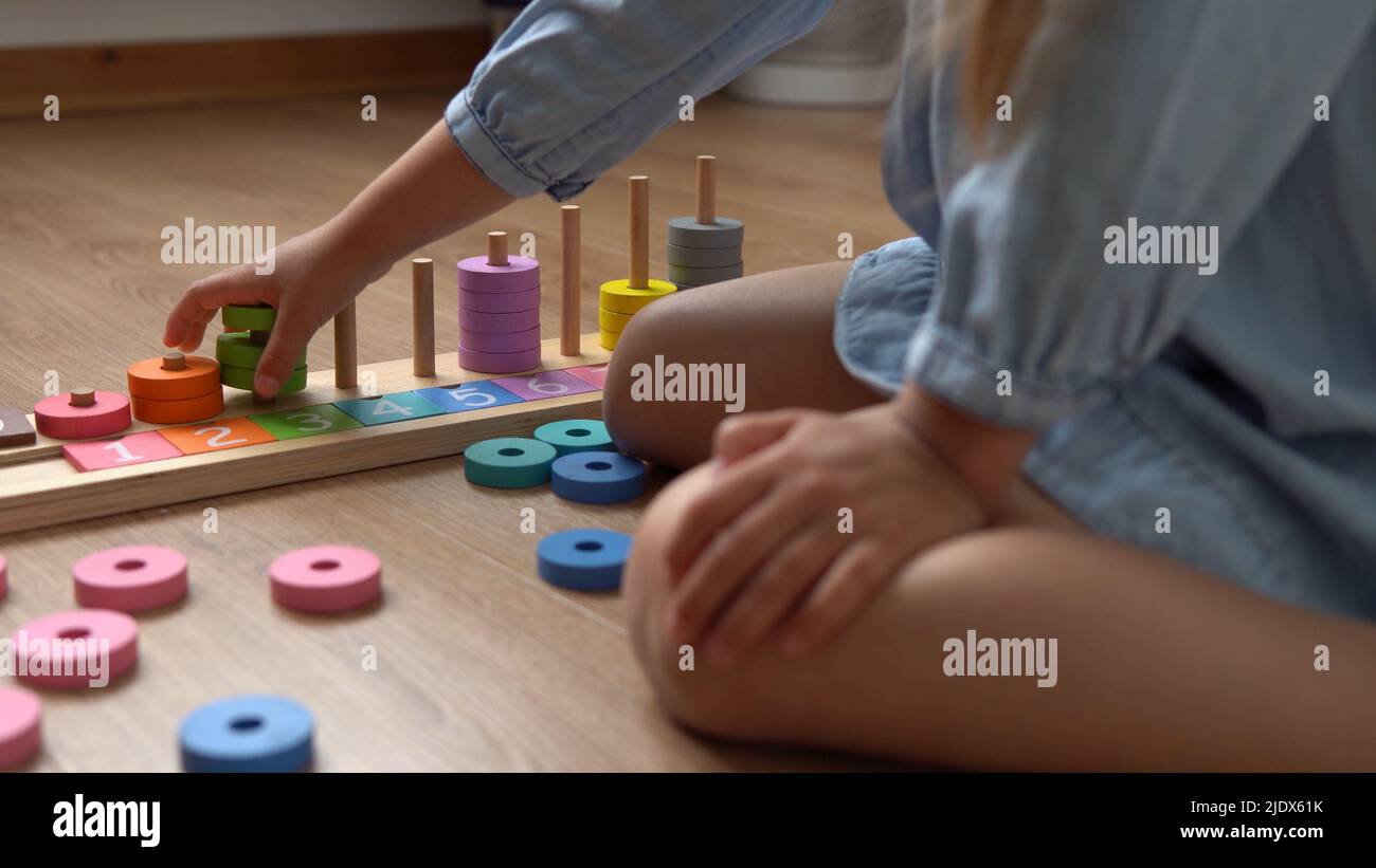 Happy Little Preschool Toothless Girl Playing With Colored Wooden Toy ...