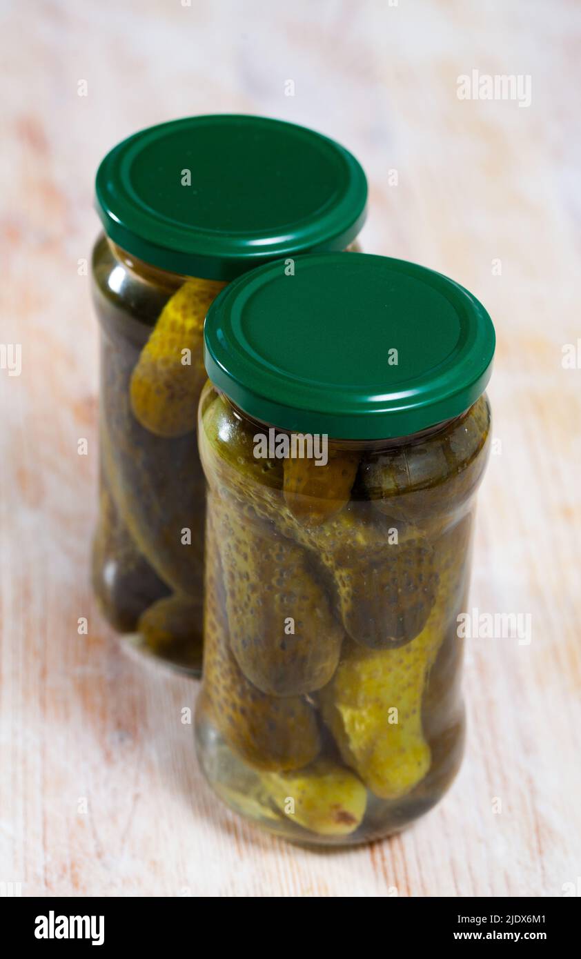 Glass bottle of marinated cucumbers Stock Photo - Alamy
