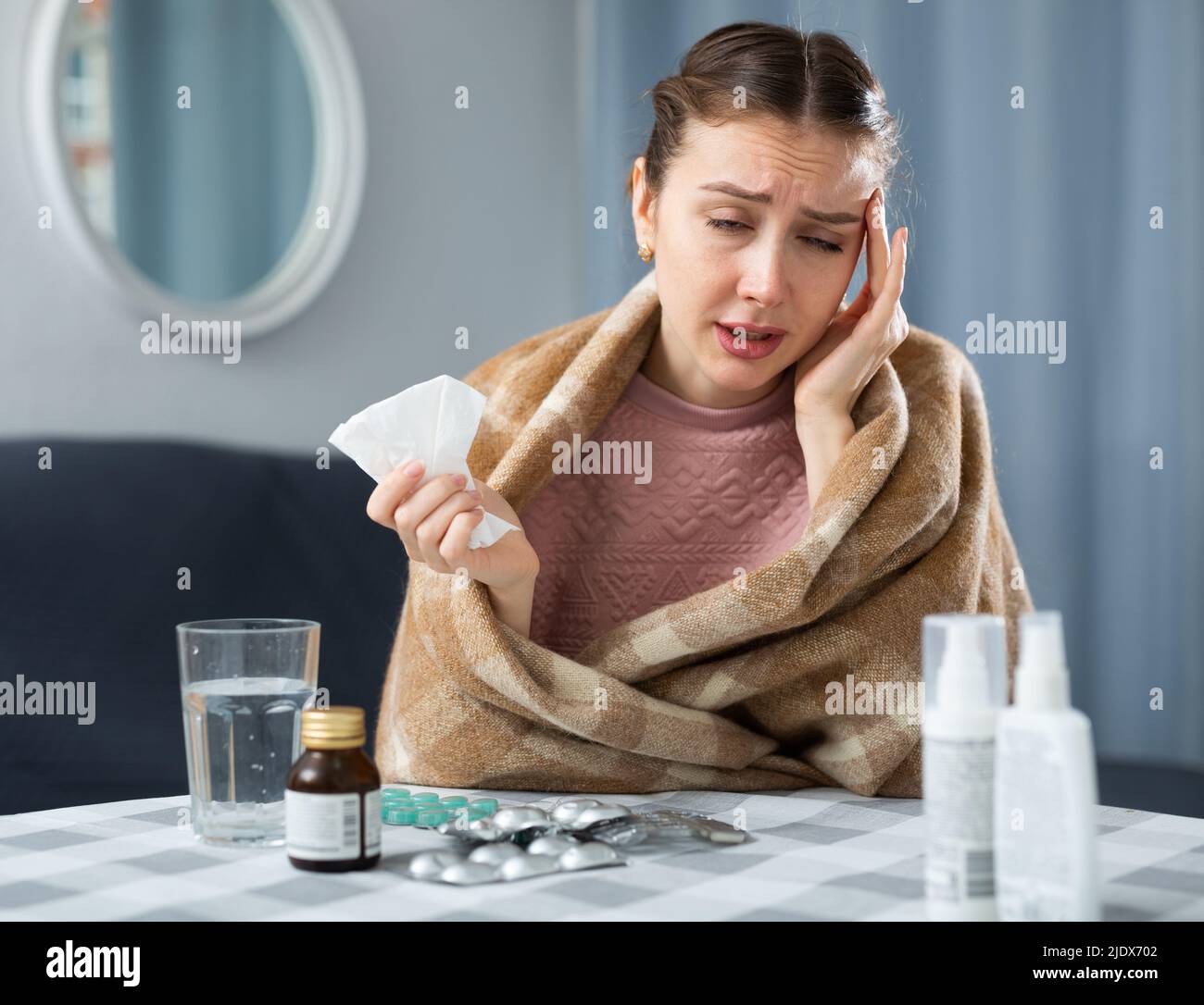 Woman fever symptoms sitting hi-res stock photography and images - Alamy