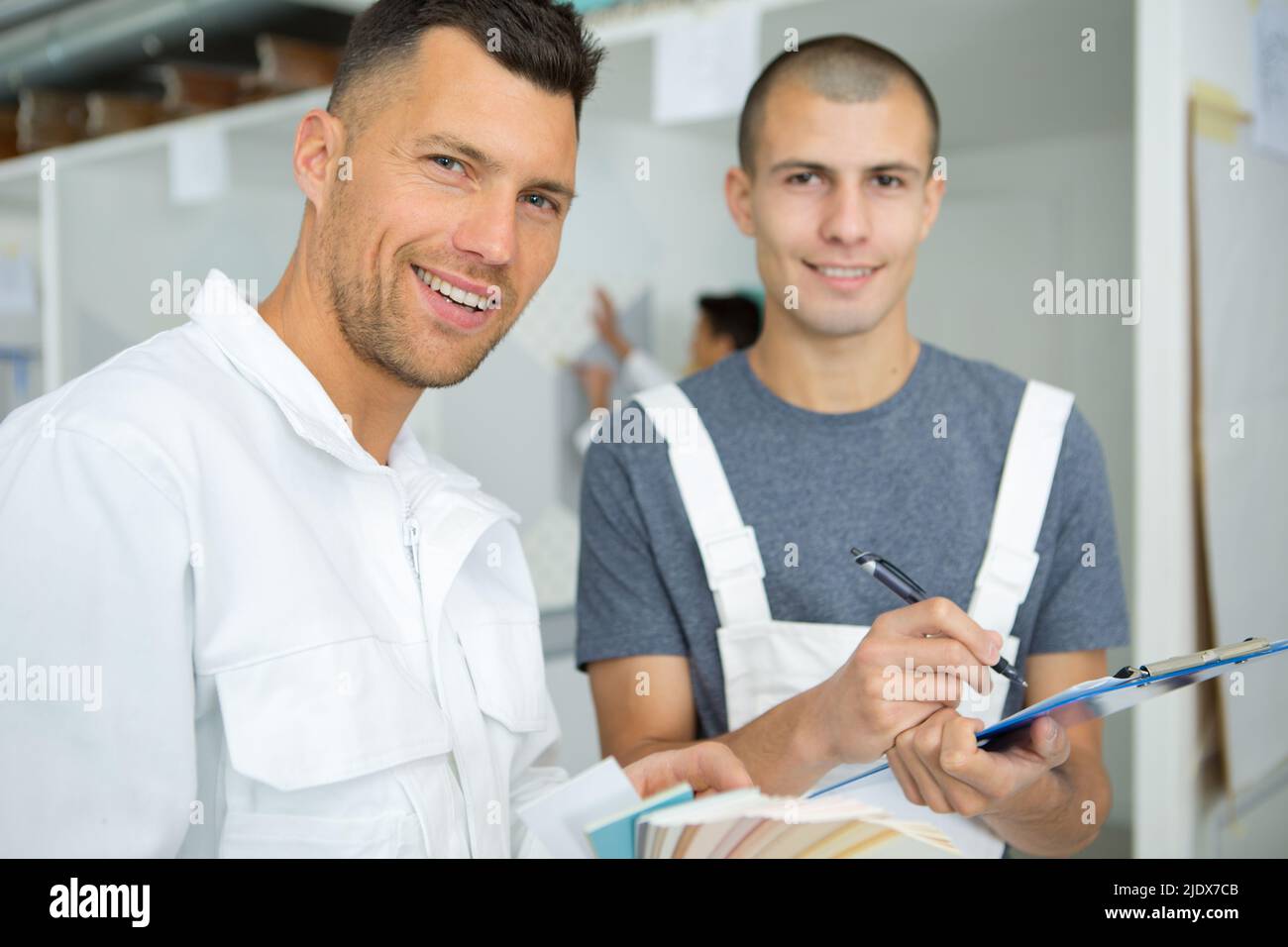 renovation worker posing and smiling Stock Photo - Alamy
