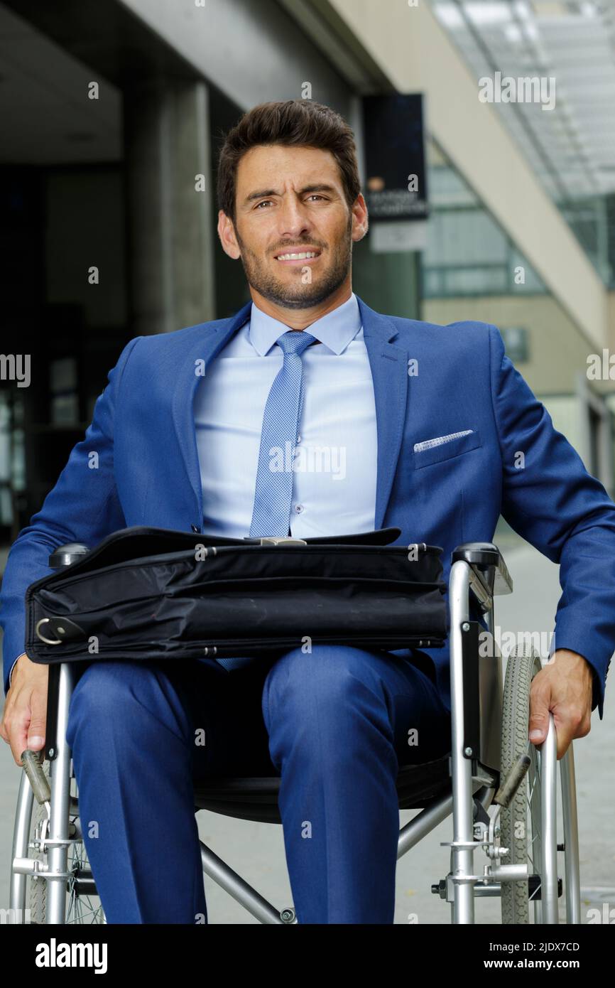 disabled businessman in wheelchair Stock Photo - Alamy